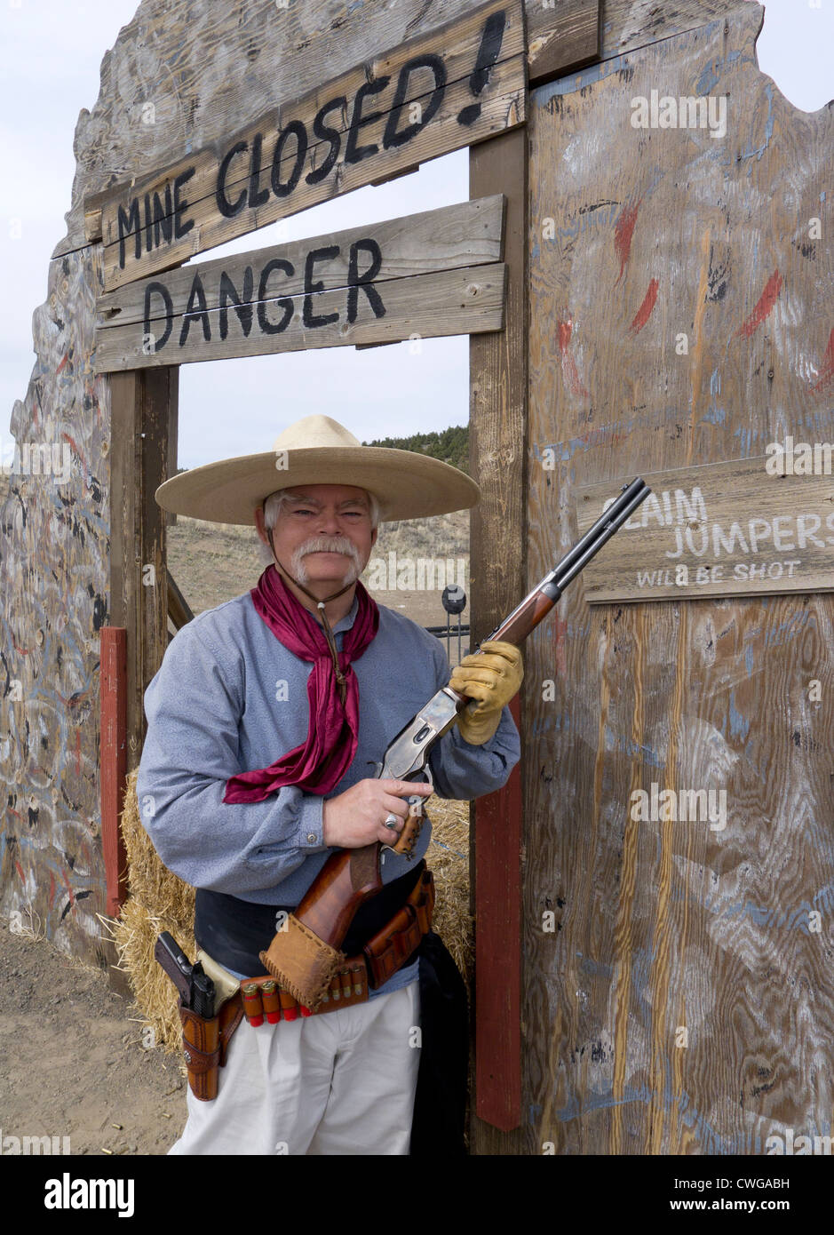 Fast draw gun competitors posing for portraits at a shooting ...