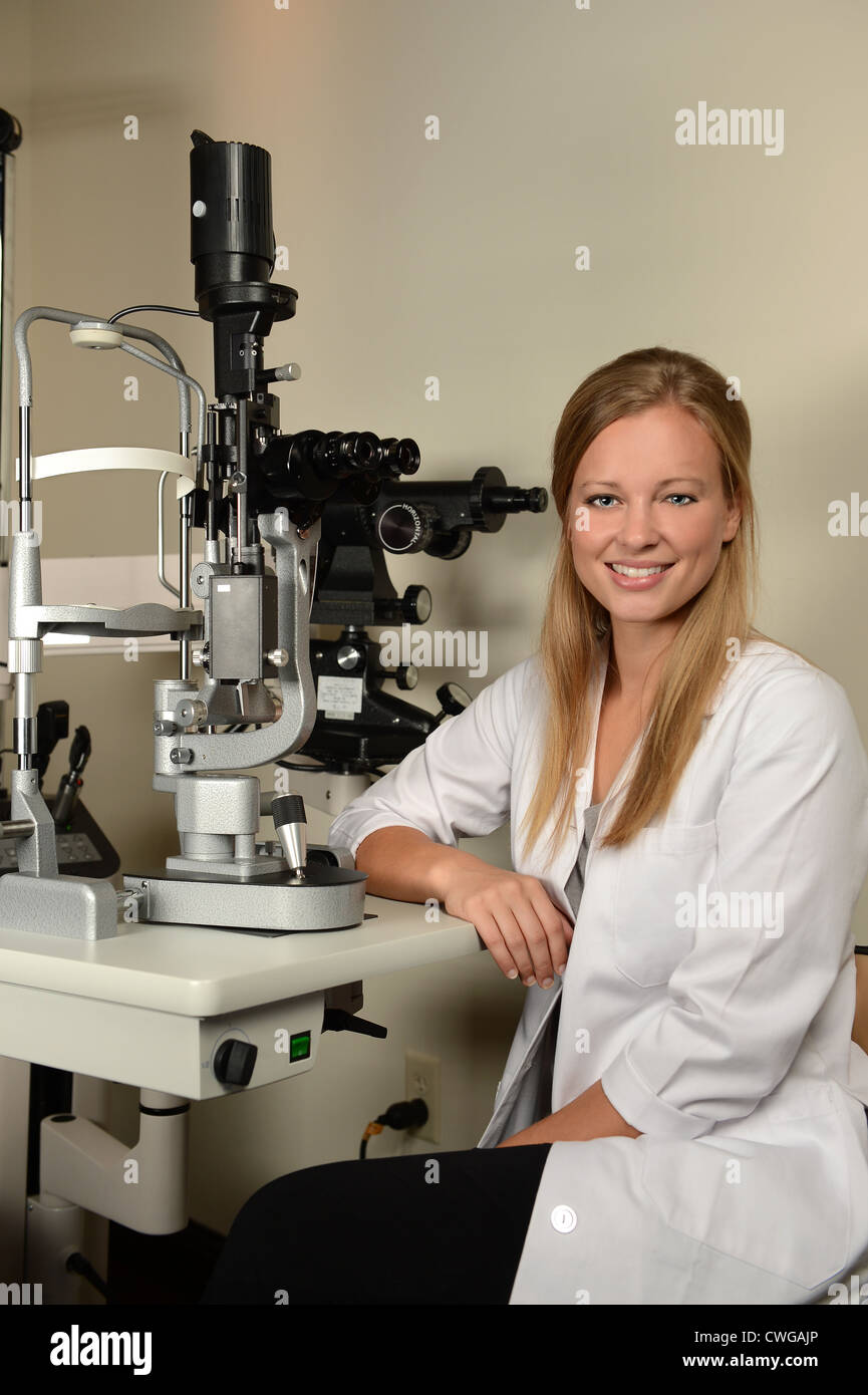 Portrait of eye doctor smiling in examination room Stock Photo - Alamy