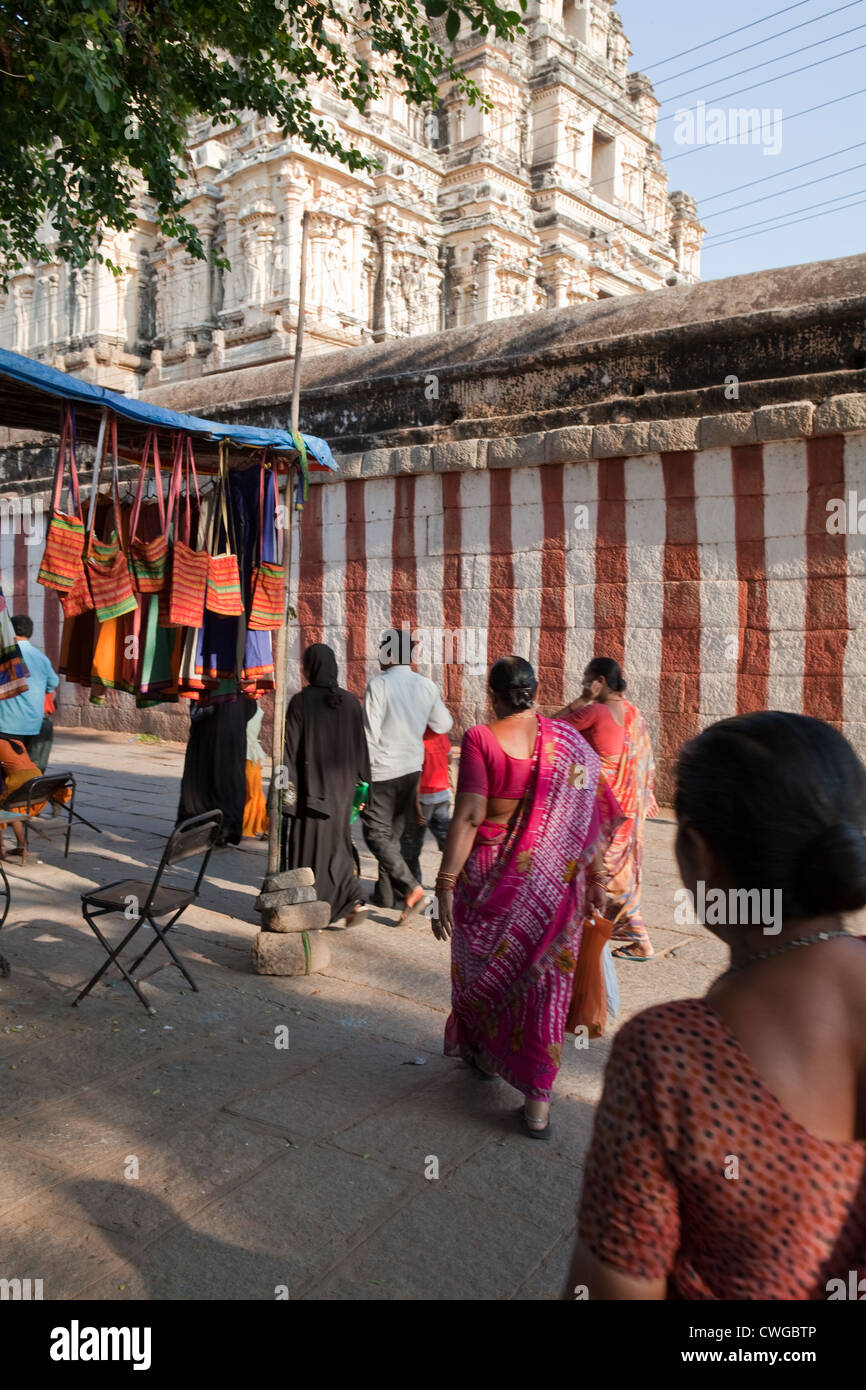 Families heading to Virupaksha temple in Hampi Bazaar Stock Photo - Alamy