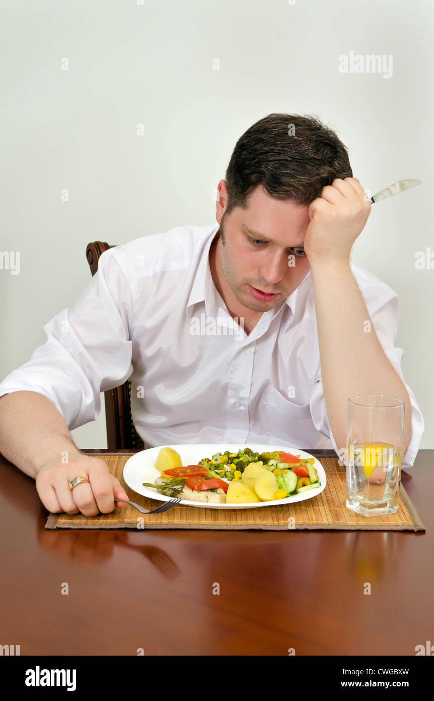 Man is disappointed with his dish Stock Photo - Alamy