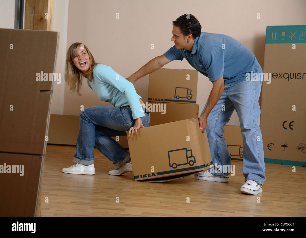 Young couple on moving Stock Photo - Alamy