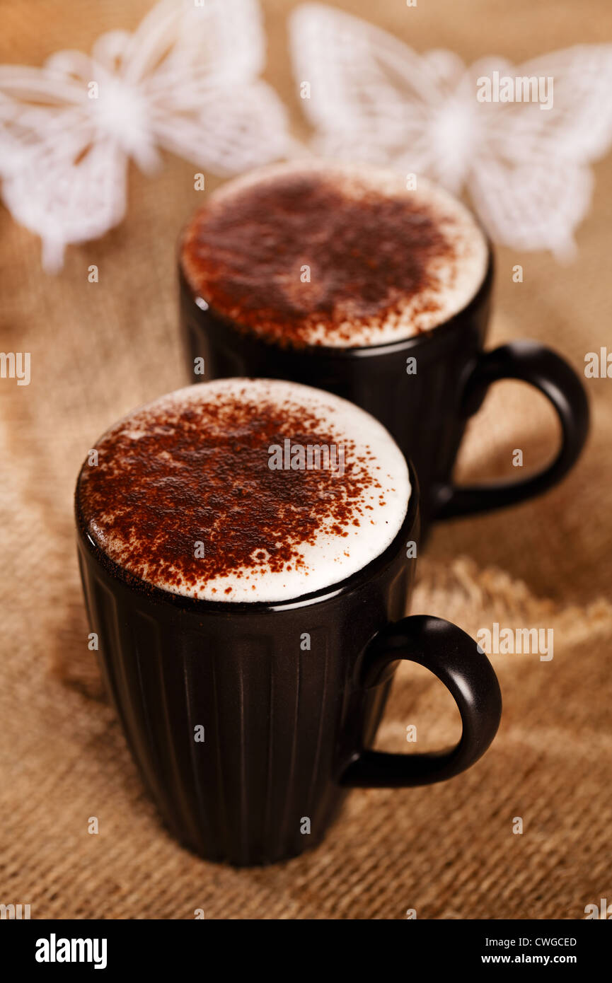 hot frothy drink cappuccino chocolate dusted, white paper butterfly ...
