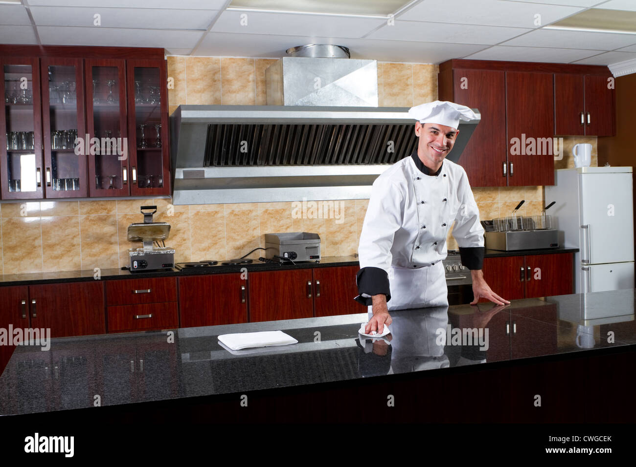 professional chef cleaning industrial kitchen Stock Photo - Alamy