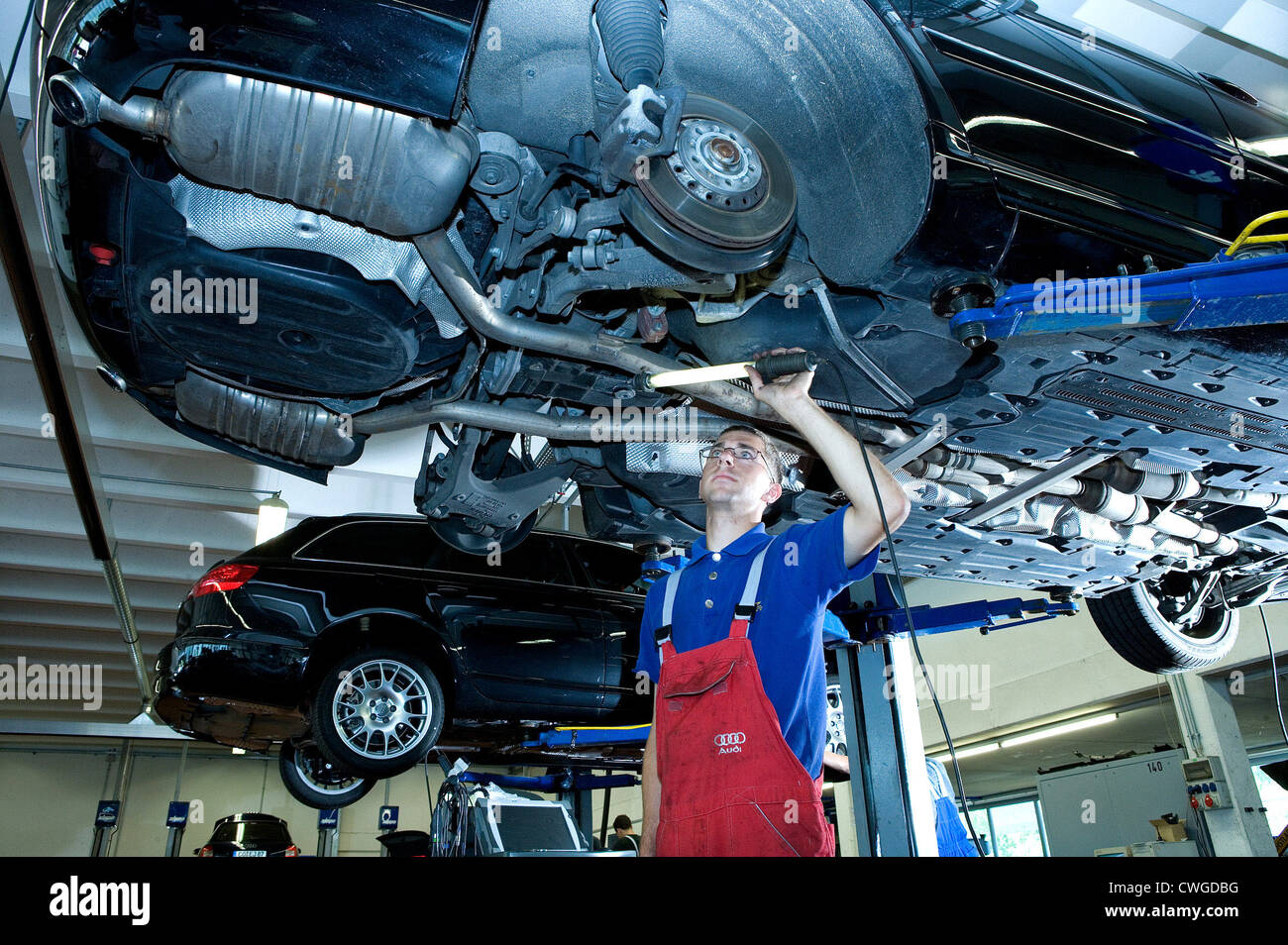 Biberach, car mechanic checks the suspension of a car with all-wheel ...