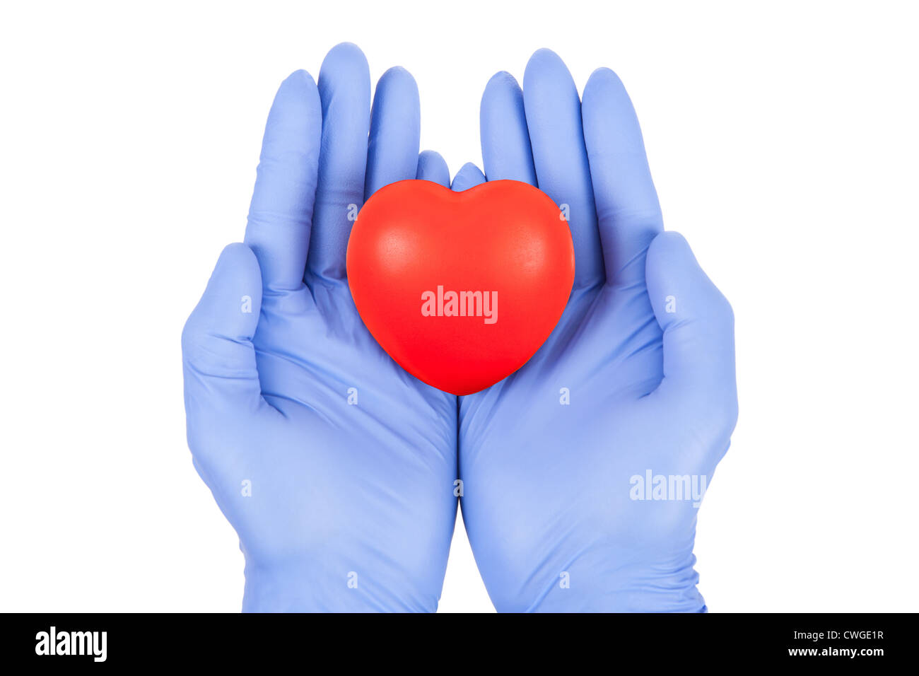 Doctor holding red heart in Cut Out Stock Images & Pictures - Alamy
