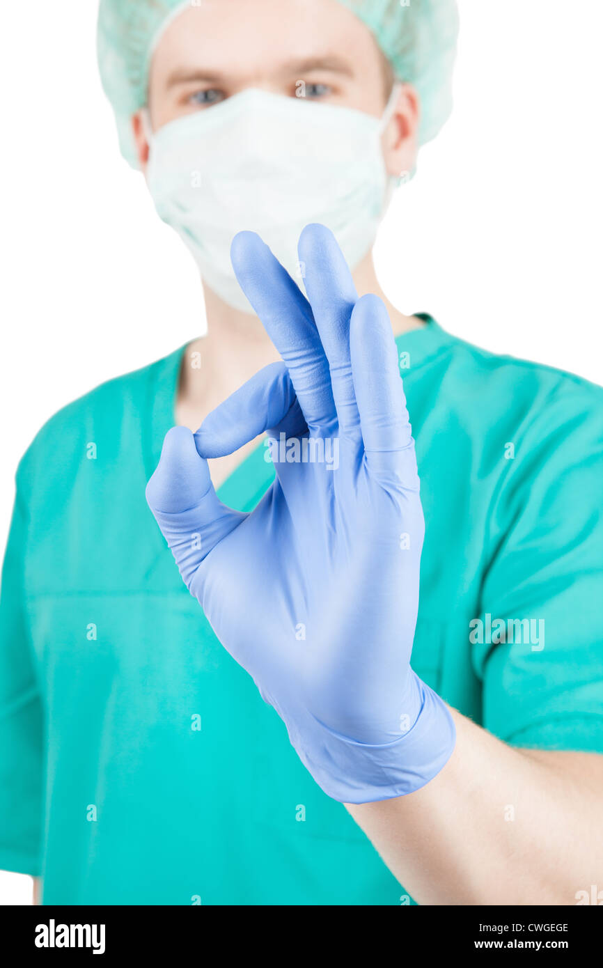 Male surgeon showing ok sign with his fingers and isolated on white ...