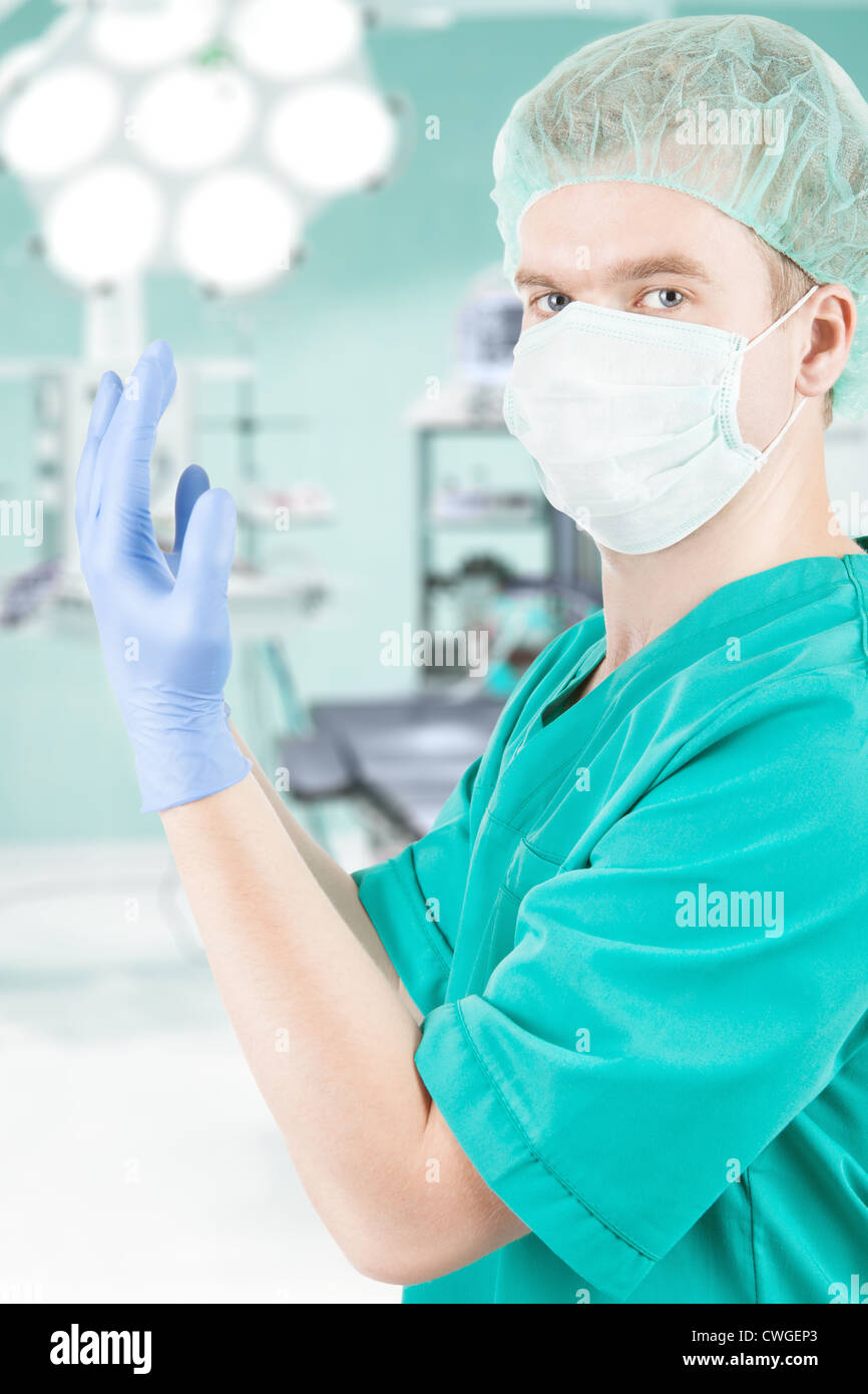 Male surgeon with raised up hands Stock Photo - Alamy