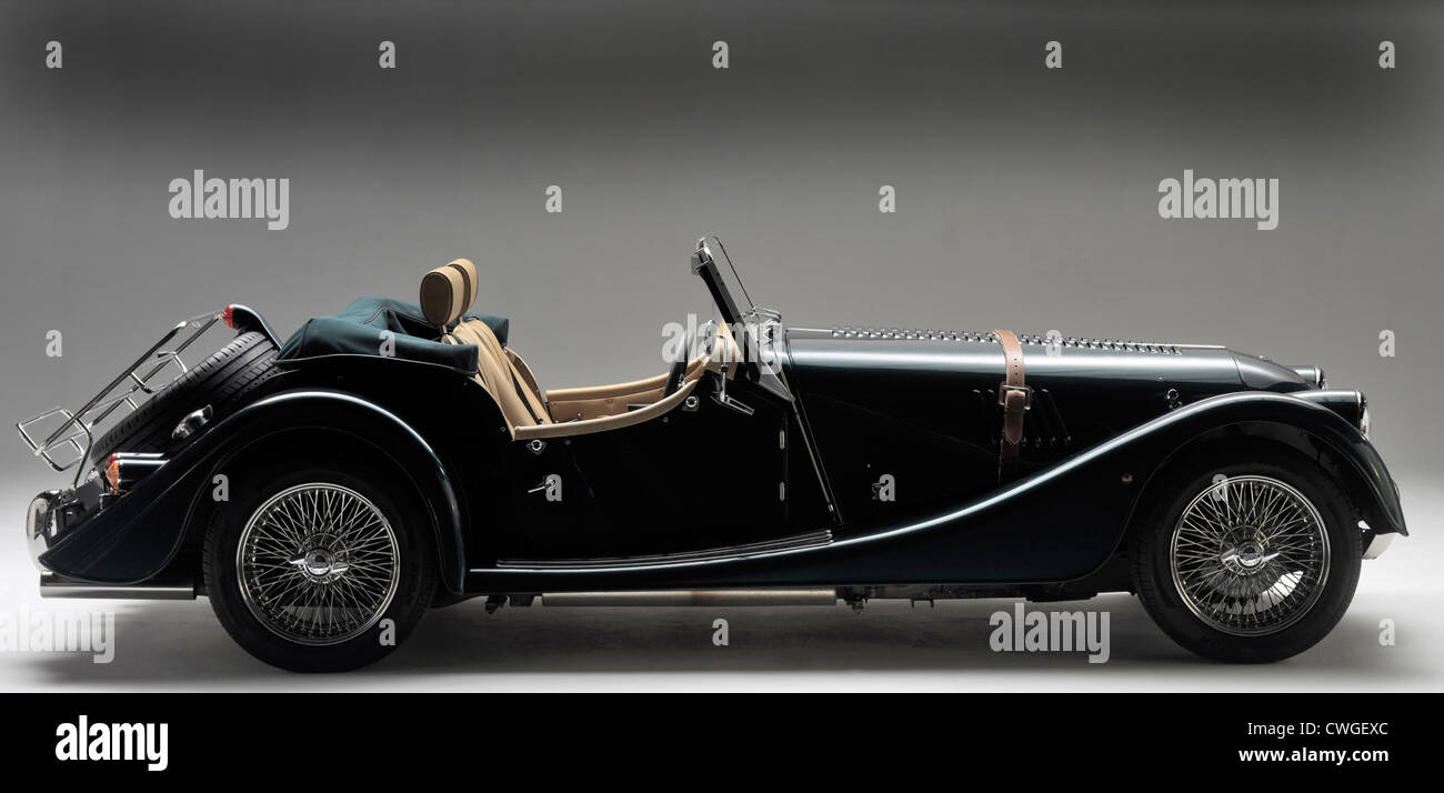 Side view of a Green Morgan Roadster 4/4 car with brown leather strap ...
