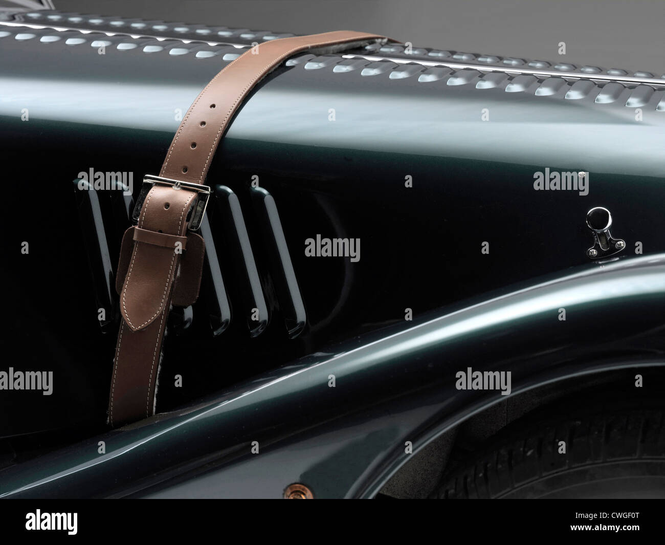 Bonnet of a Green Morgan Roadster 4/4 car with brown leather strap ...