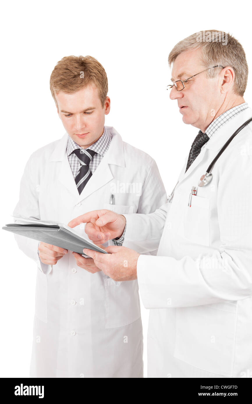 Two medical doctors discussing something - studio shot Stock Photo - Alamy