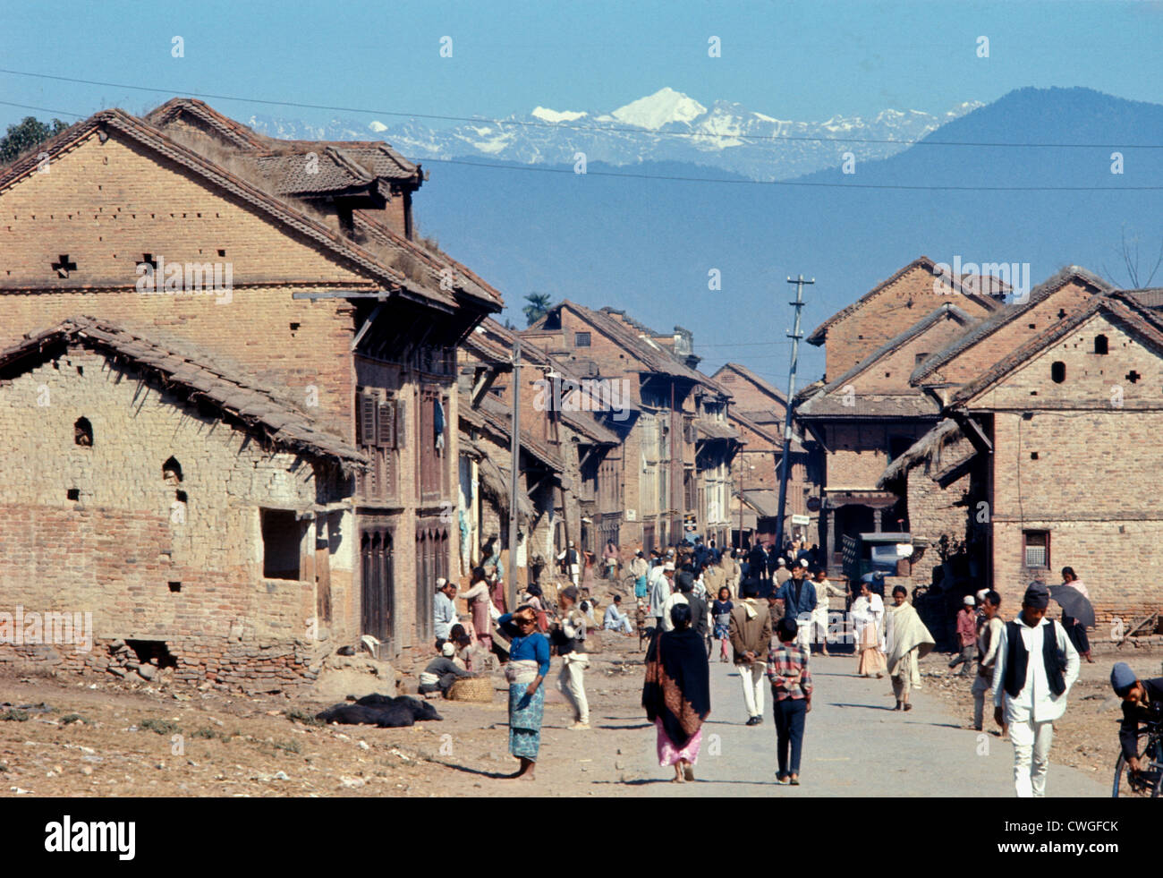 A street in Patan town in Nepal with architecture and pedestrians, 1971 ...