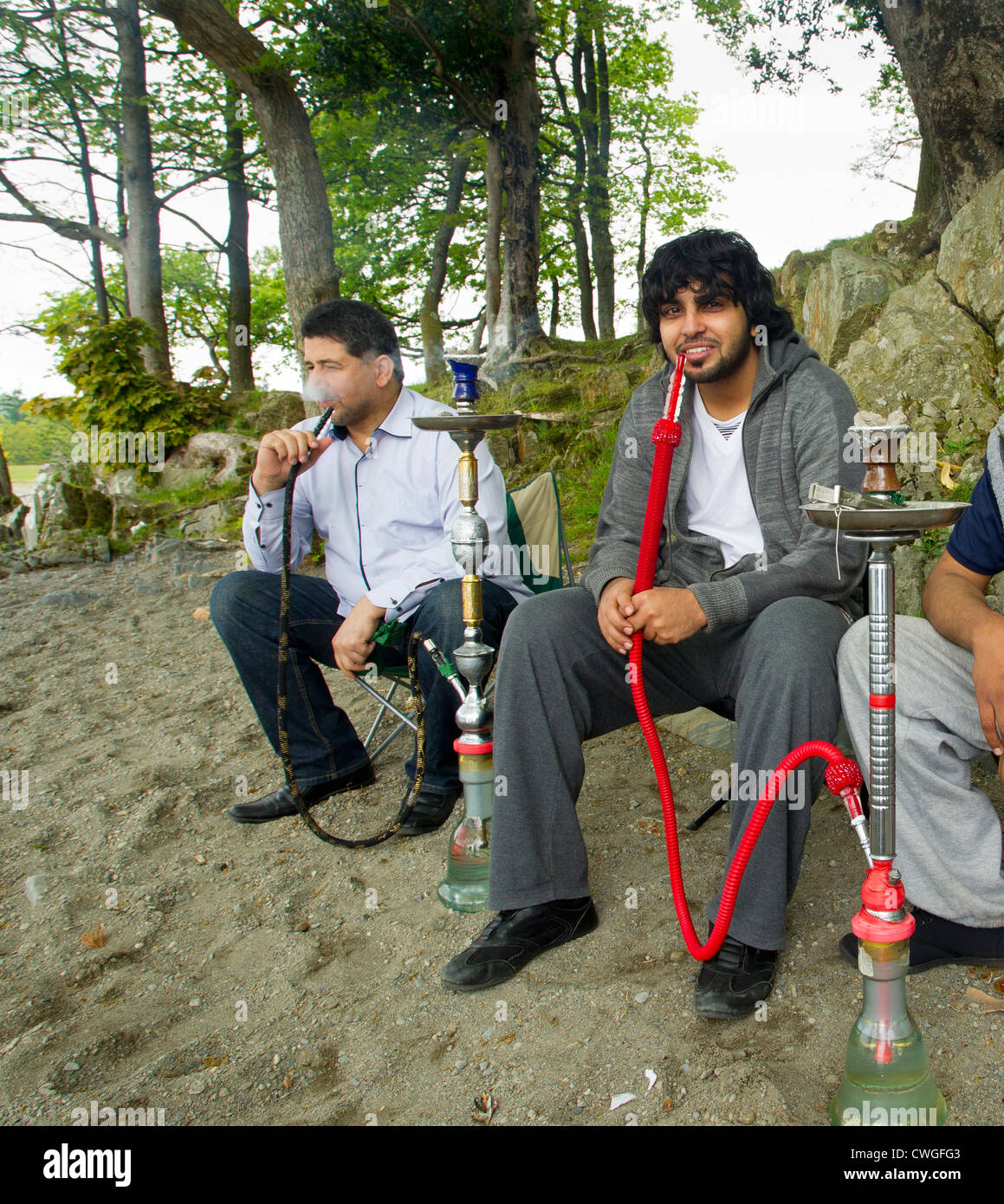 A group smoking their traditional hookah- on the shores of Lake ...