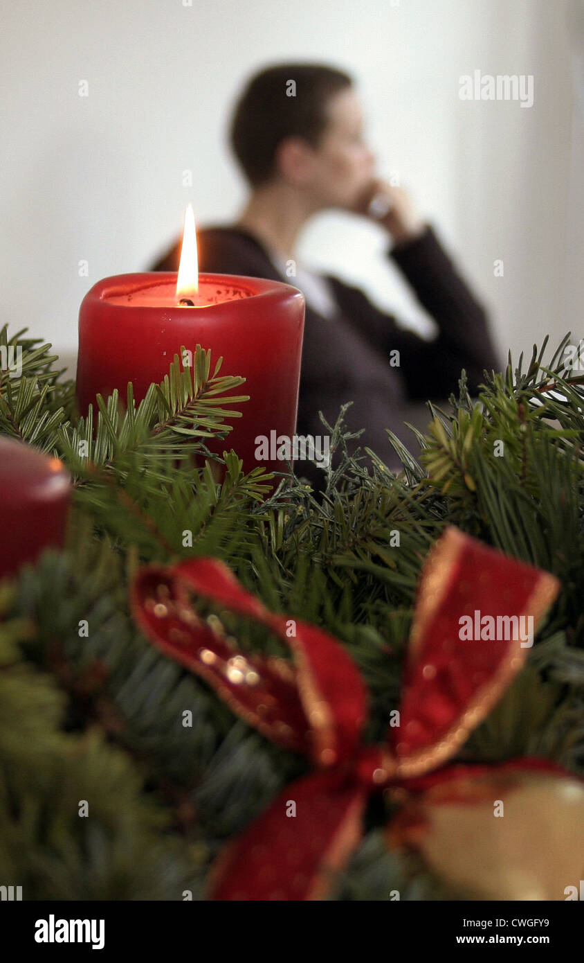 A pensive woman by candlelight Stock Photo - Alamy