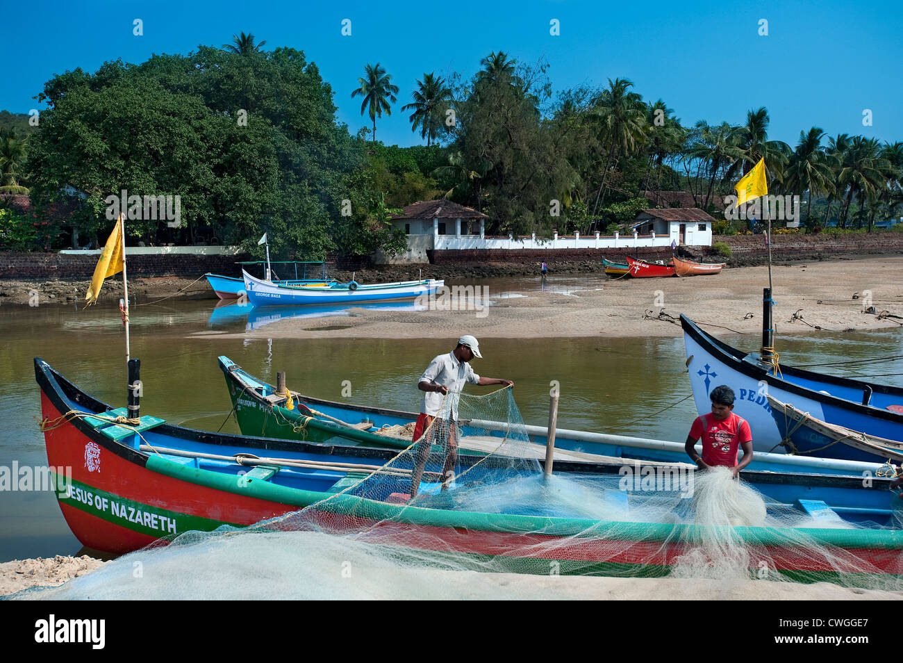 Fishermen on river estuary, Baga, Goa, India Stock Photo - Alamy