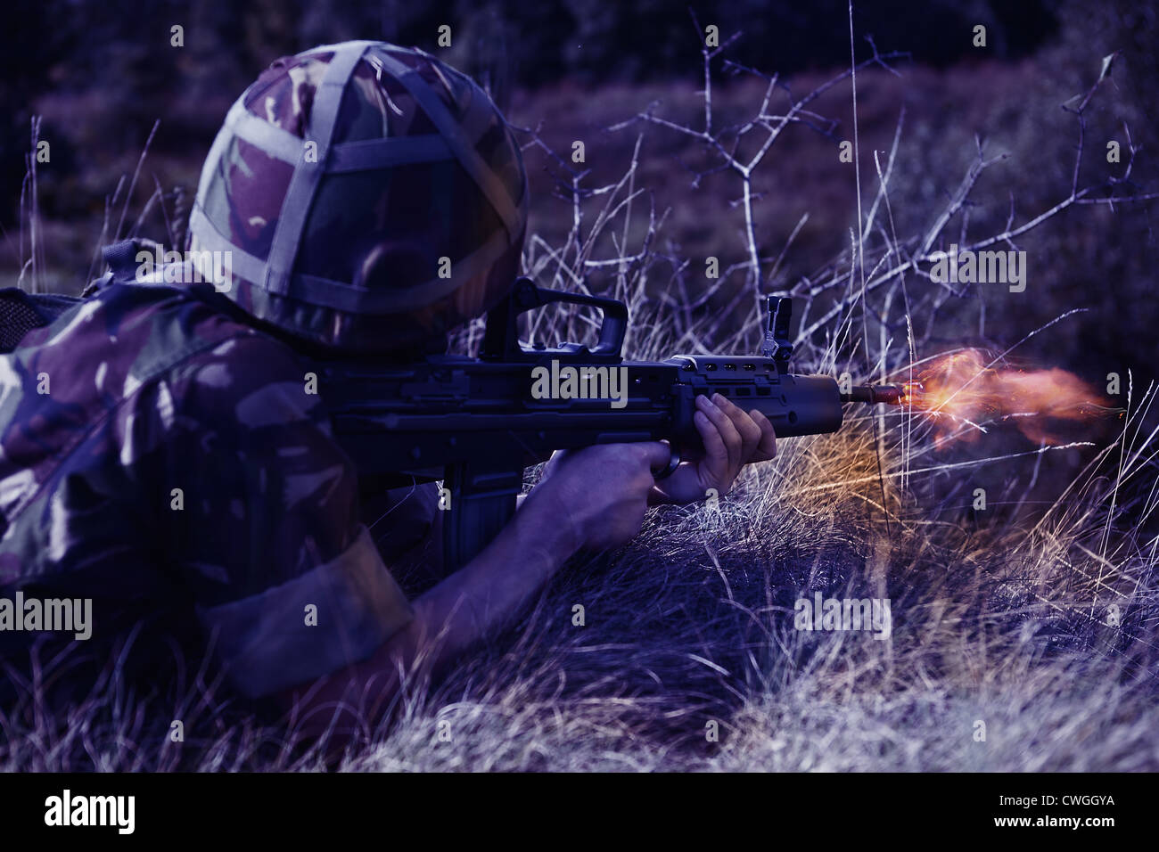 Young soldier with gun Stock Photo - Alamy