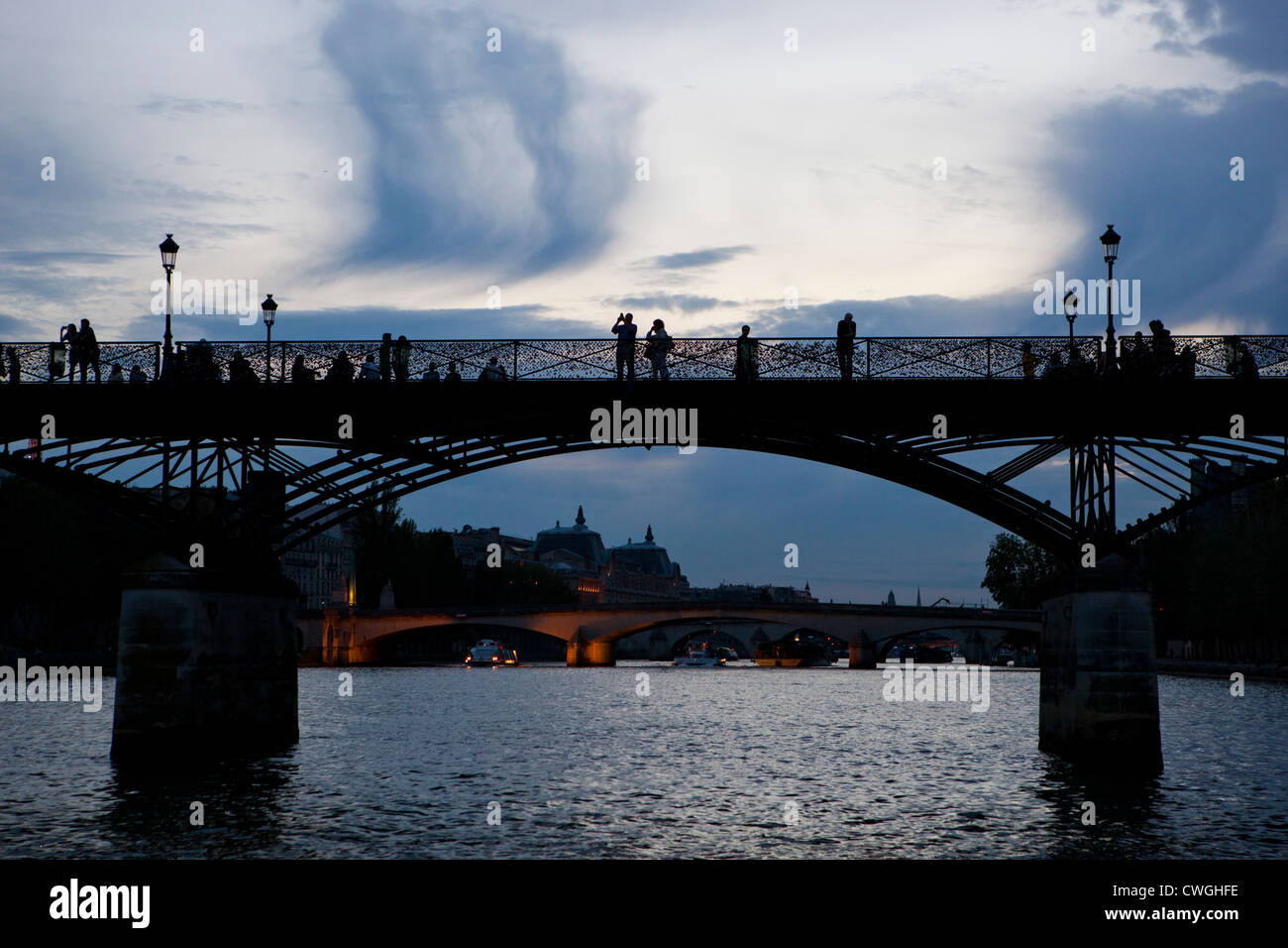 The bridges on the Seine river at sunset in Paris, France Stock Photo ...
