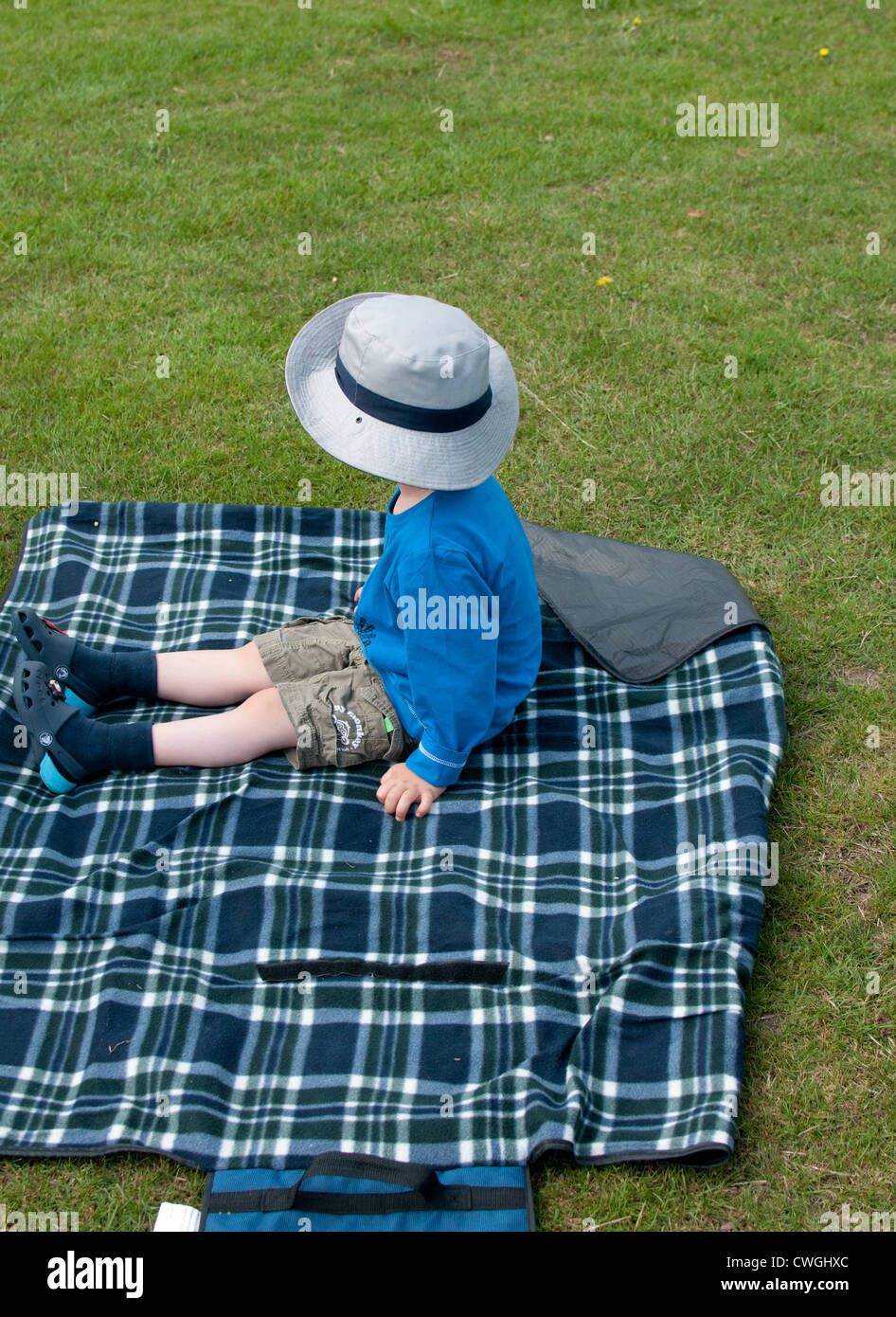 boy on rug at festival Stock Photo - Alamy