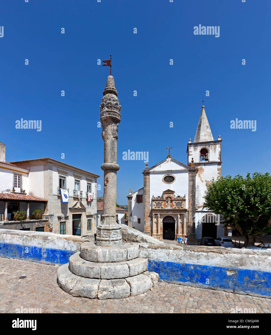 Obidos Town Pillory and Santa Maria Church seen from Direita Street ...