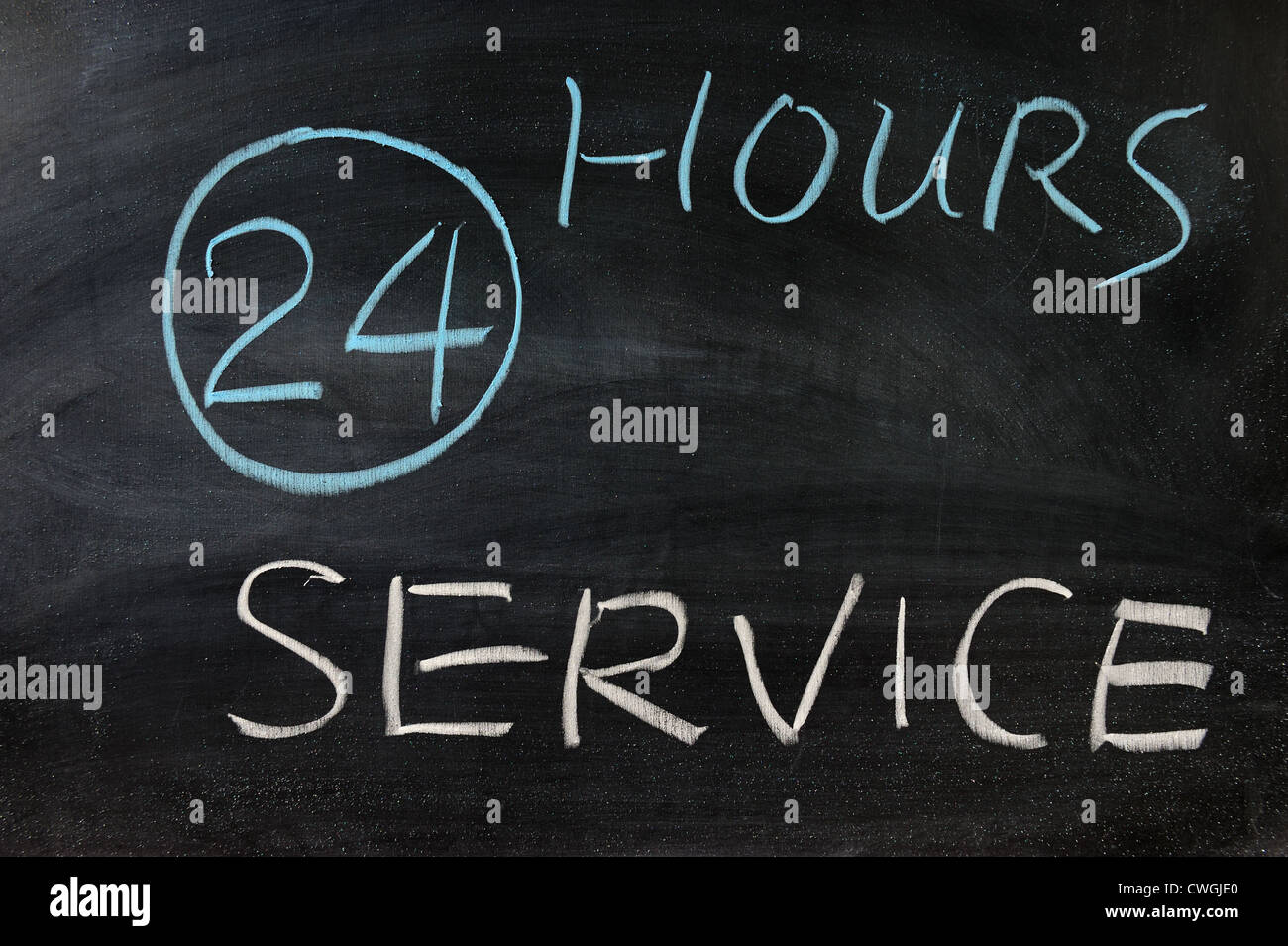 24 Hours service words written on the chalkboard Stock Photo - Alamy