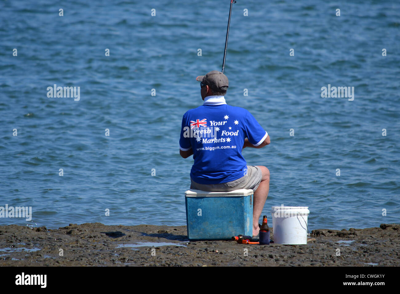 Man sitting on bucket fishing hi-res stock photography and images - Alamy