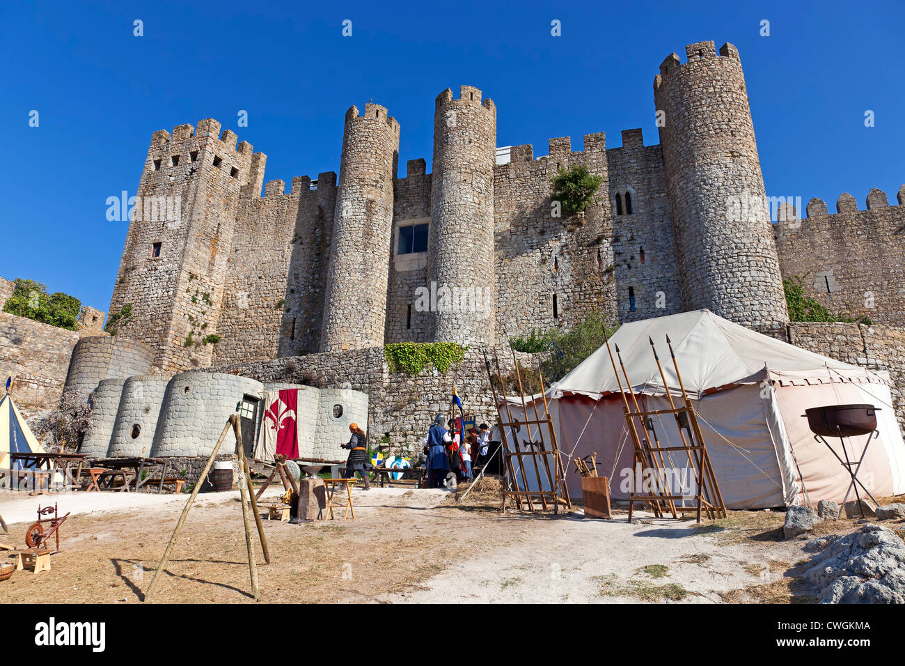 Obidos Castle during the Medieval Fair reenactment. Obidos is a very ...