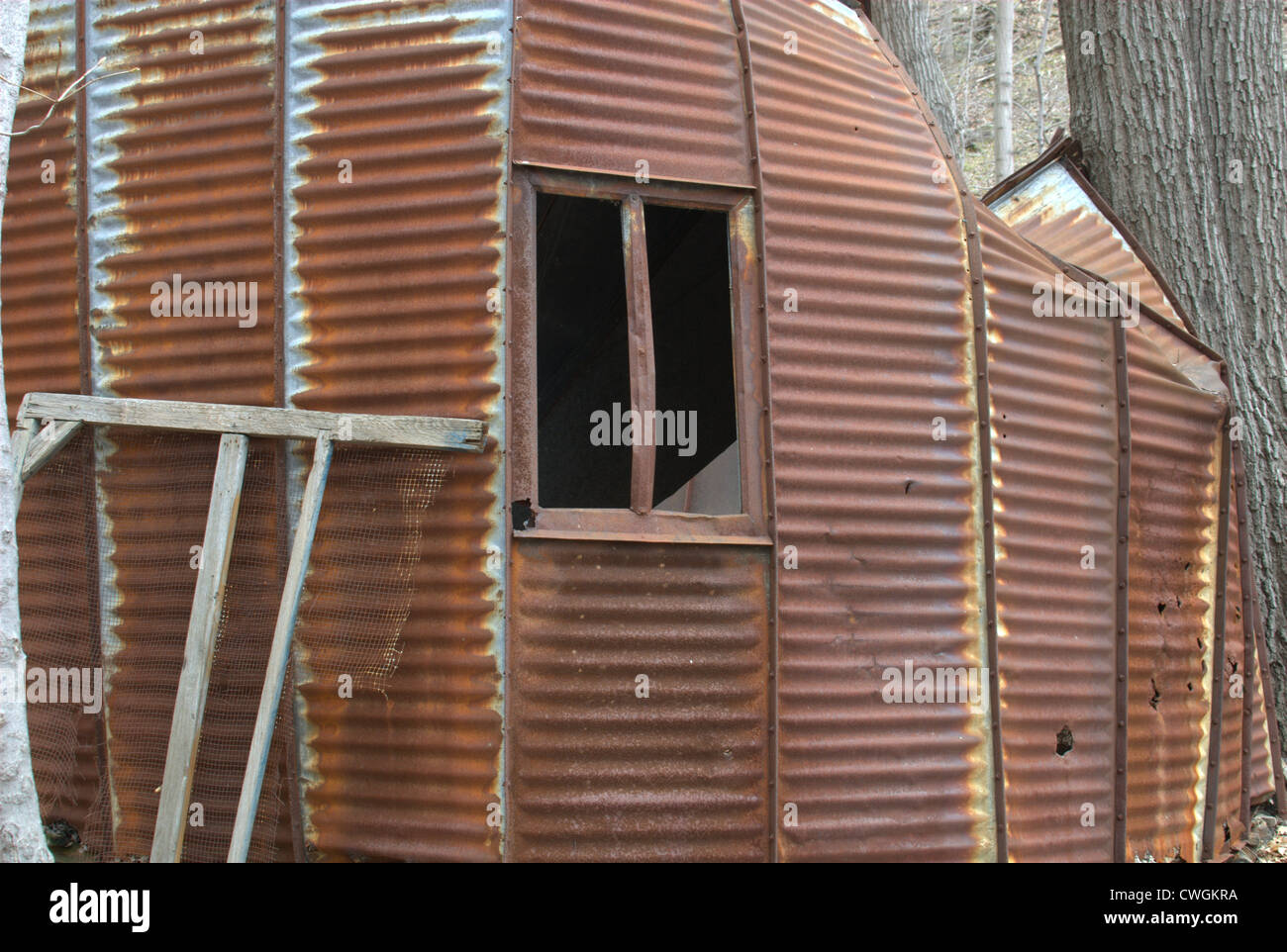 abandoned rusty metal shed surrounded by trees Stock Photo - Alamy