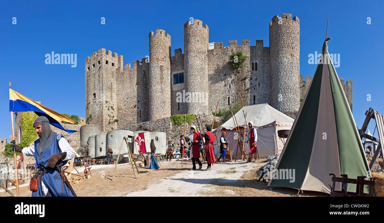 Obidos Castle during the Medieval Fair reenactment. Obidos is a very ...