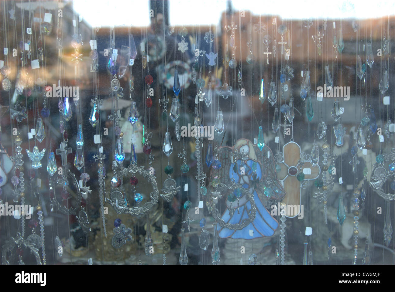 looking through glass at glittery objects and reflection of buildings ...