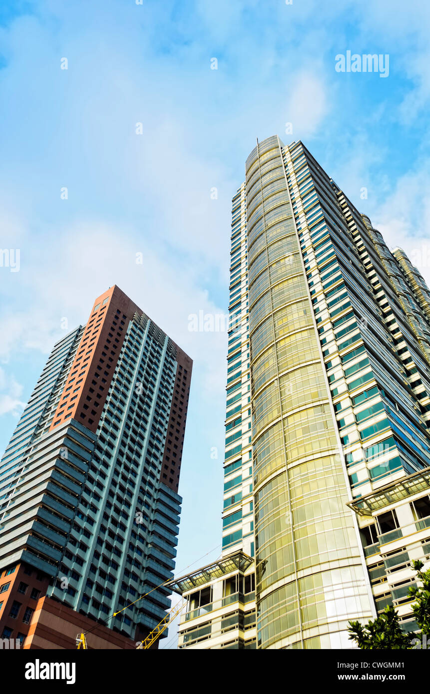 Worm's eye view of two buildings with construction crane between them ...