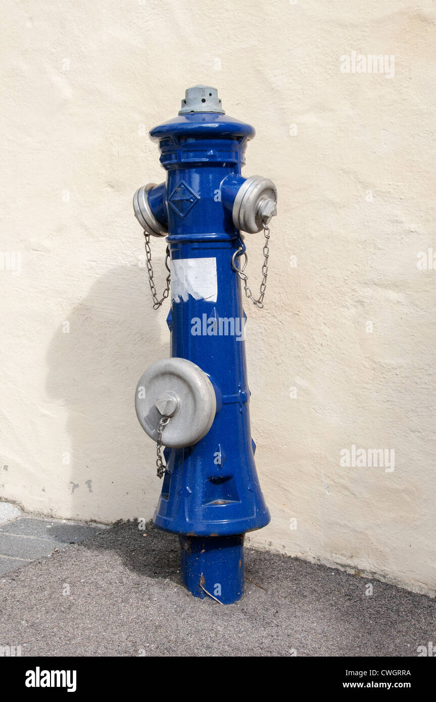 blue water hydrant at a white wall in germany Stock Photo - Alamy