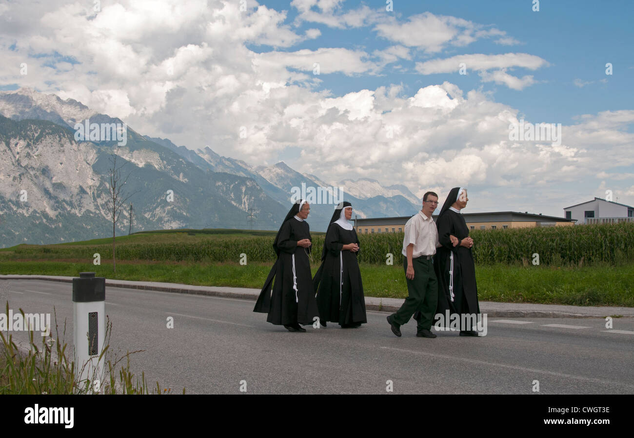 religious nones walking in the mountains in austria Stock Photo - Alamy