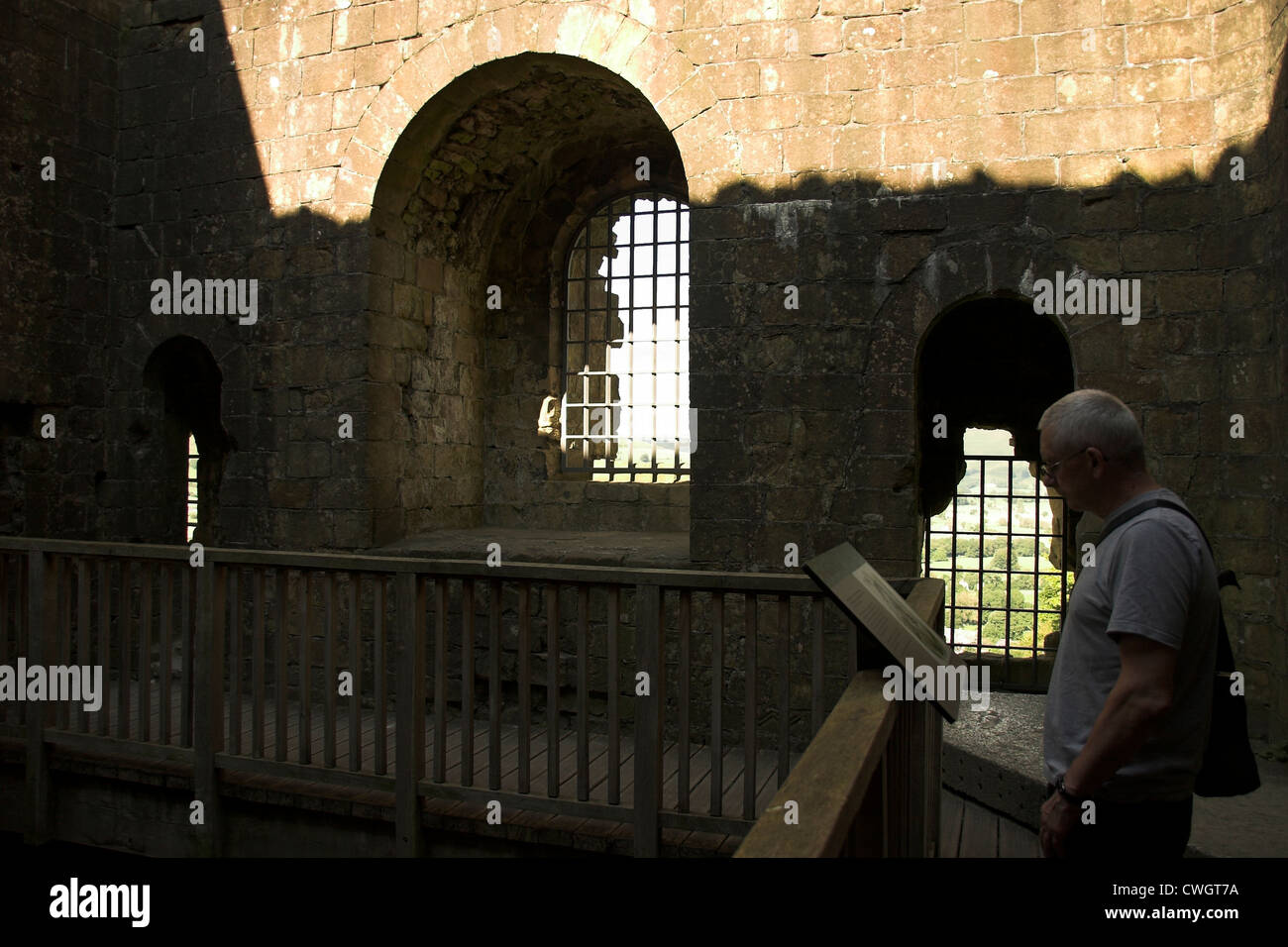 Visitor at a castle ruins interior, Peveril Castle, Castleton, Peak ...