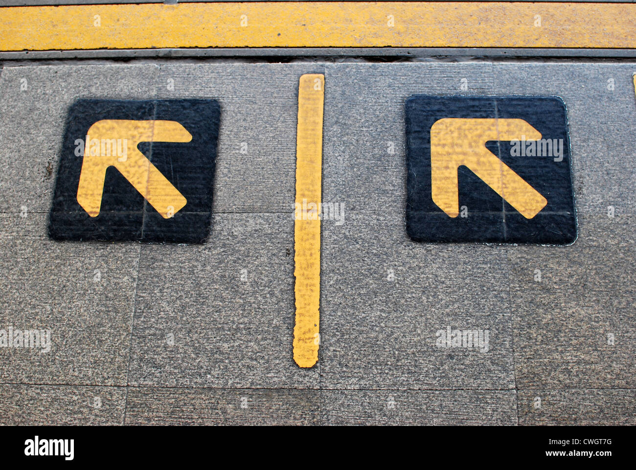 Yellow direction arrows Stock Photo - Alamy