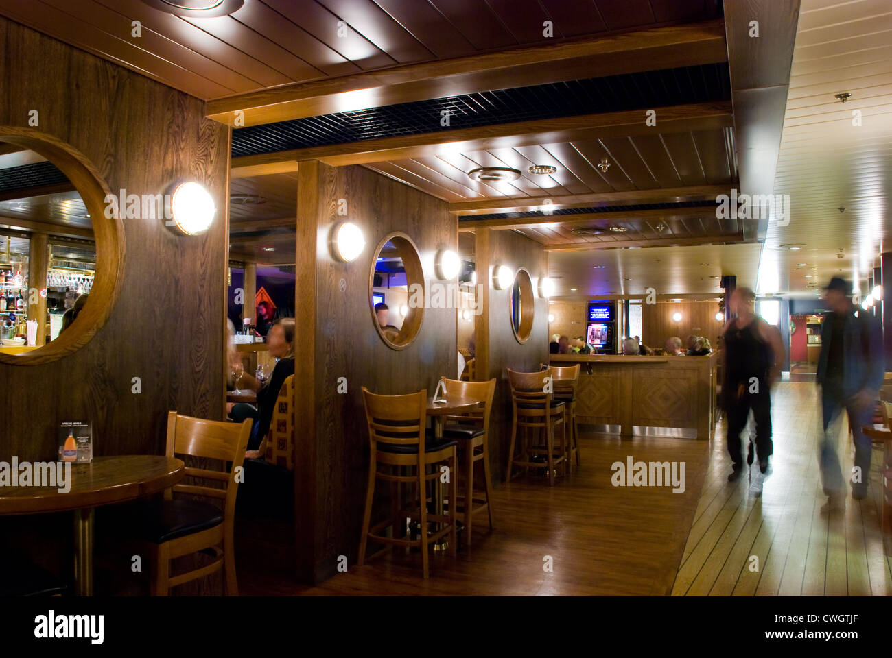 Cosy pub with people having dinner Stock Photo - Alamy