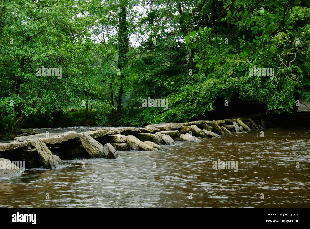 The Tarr Steps are a medieval clapper bridge across the River Barle in ...