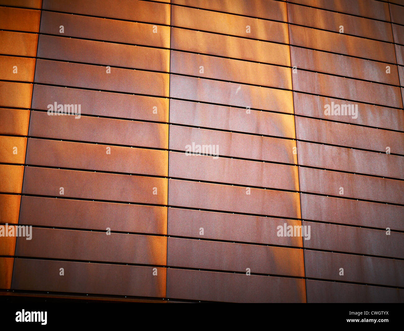 Modern architecture showing rusty gladding on building Stock Photo - Alamy
