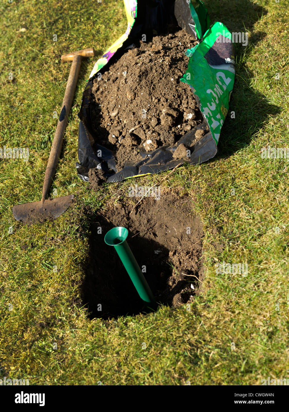 Digging A Hole Ready To Plant A Tree In Garden England Stock Photo - Alamy