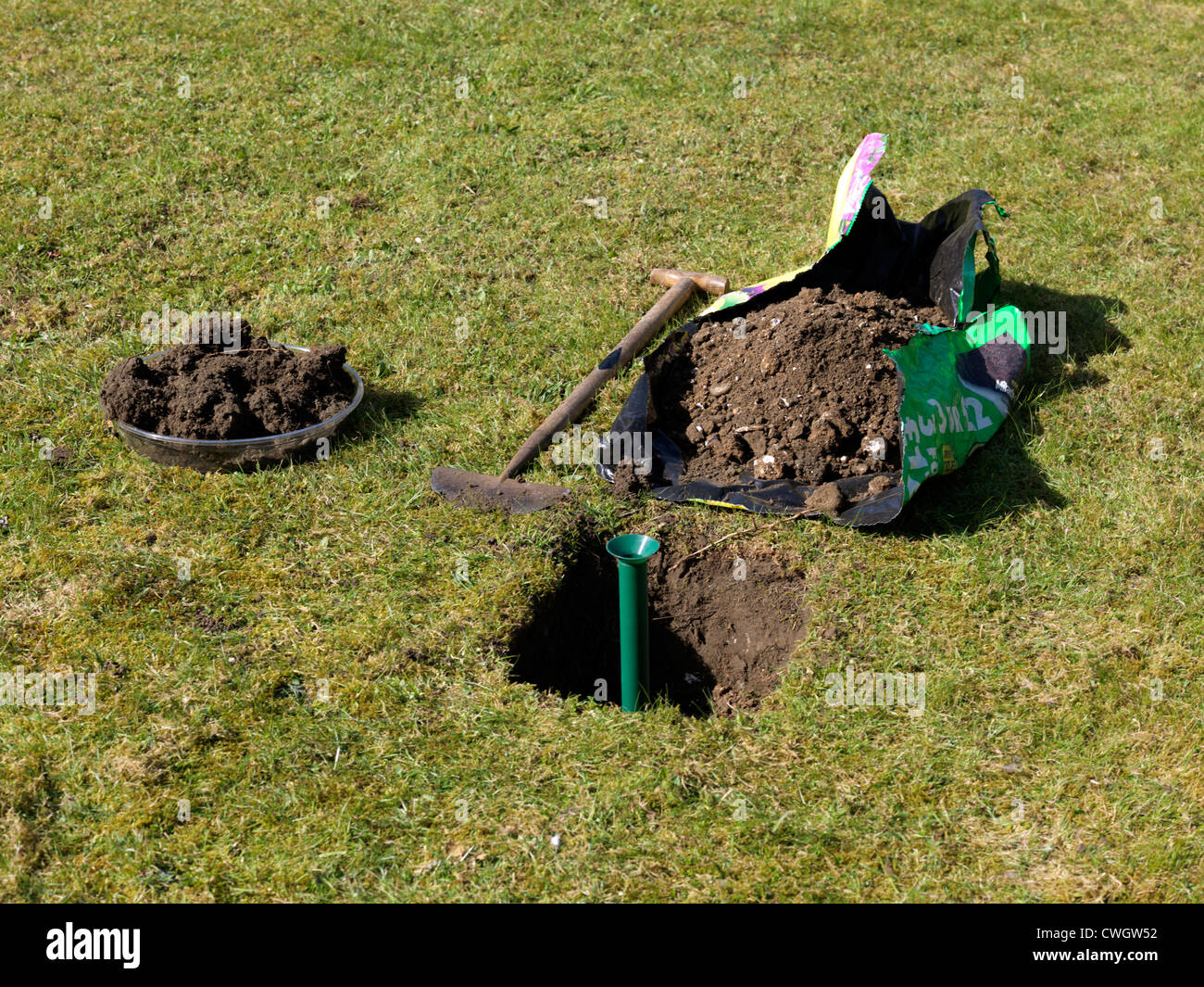 Digging A Hole Ready To Plant A Tree In Garden England Stock Photo - Alamy
