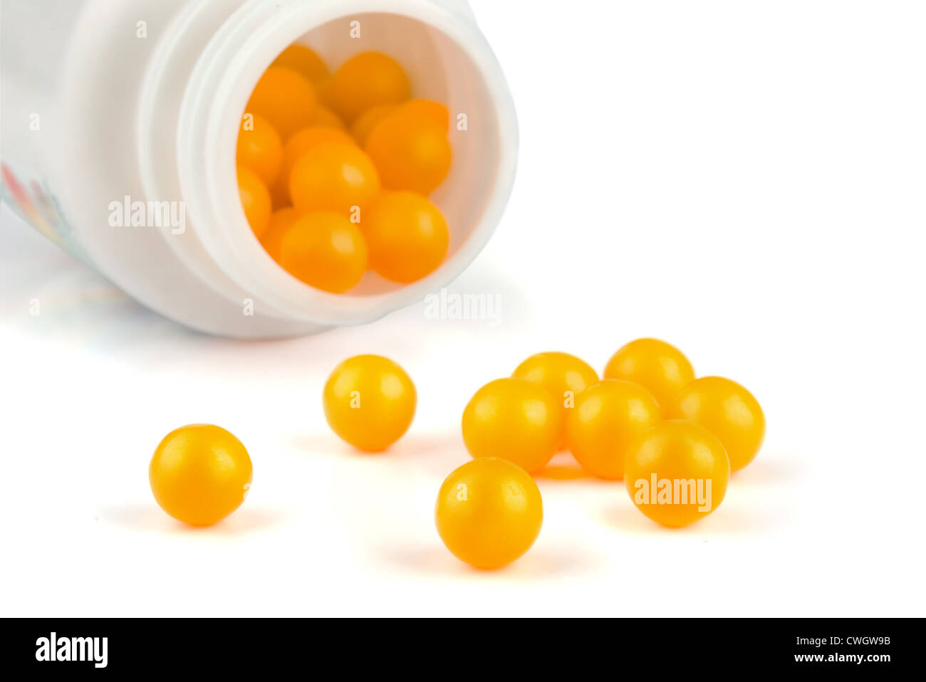yellow vitamin pills isolated on white beckground Stock Photo - Alamy