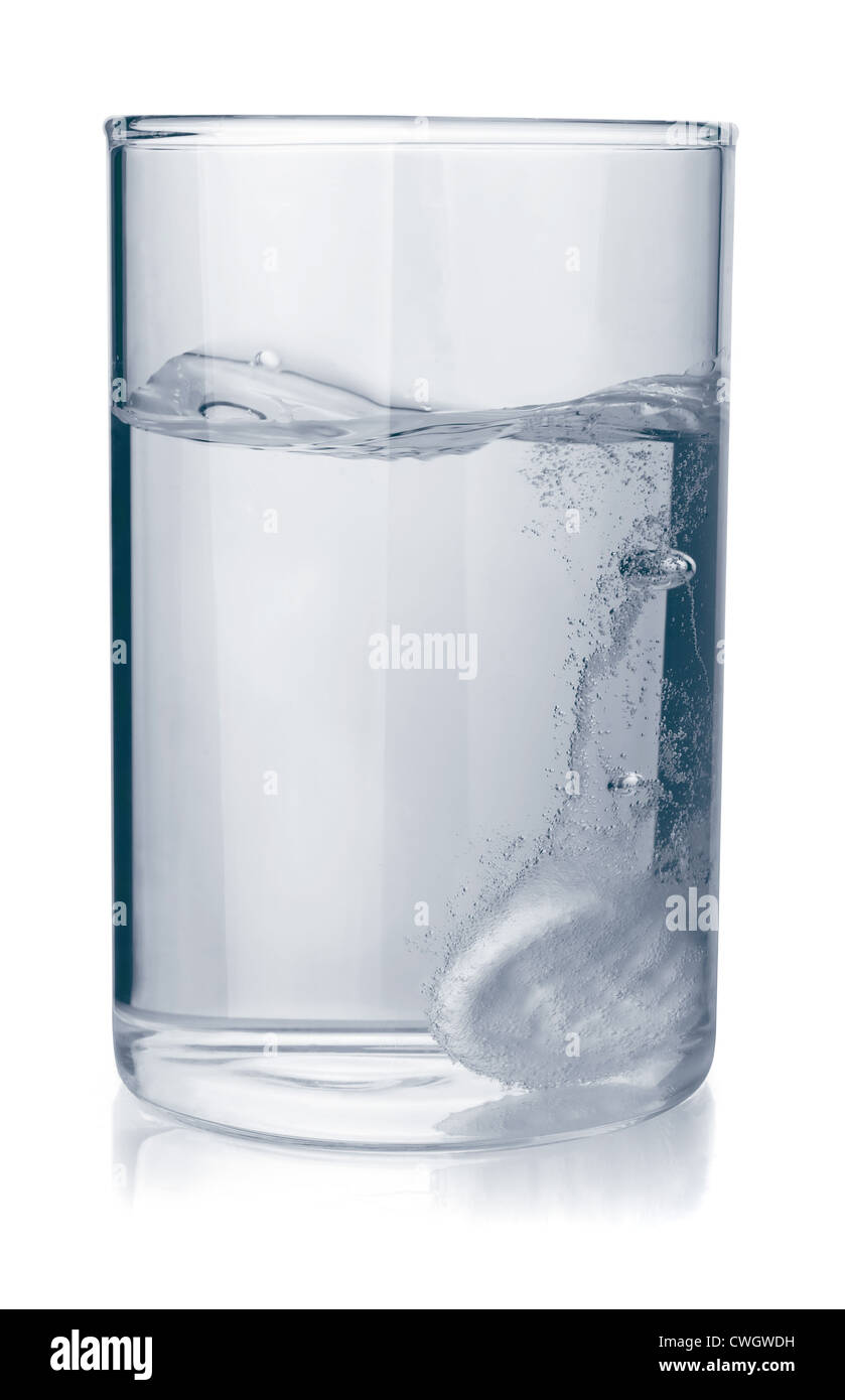 Effervescent vitamin tablet dissolving in Cut Out Stock Images ...