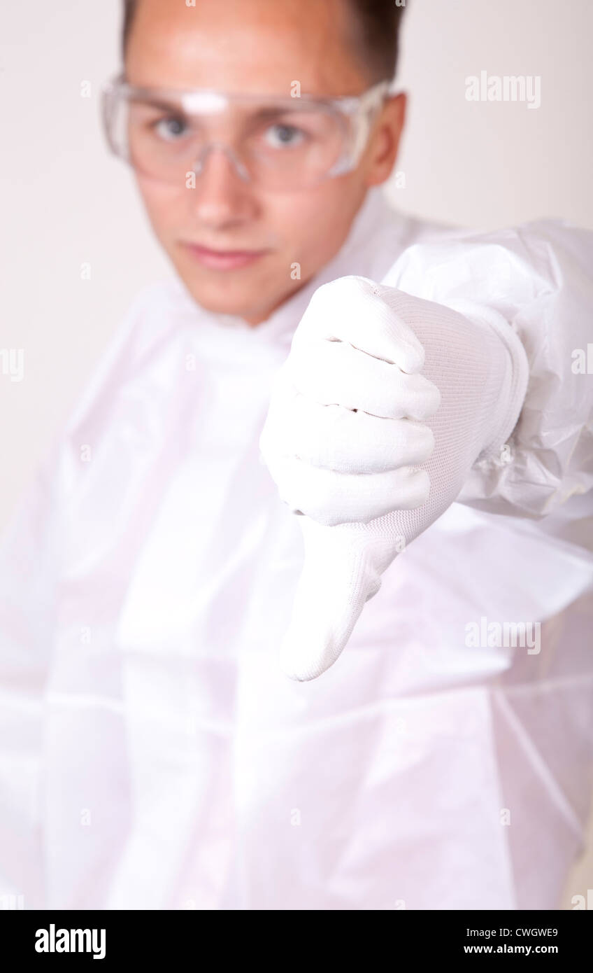 Young laboratory technician showing thumb down Stock Photo - Alamy