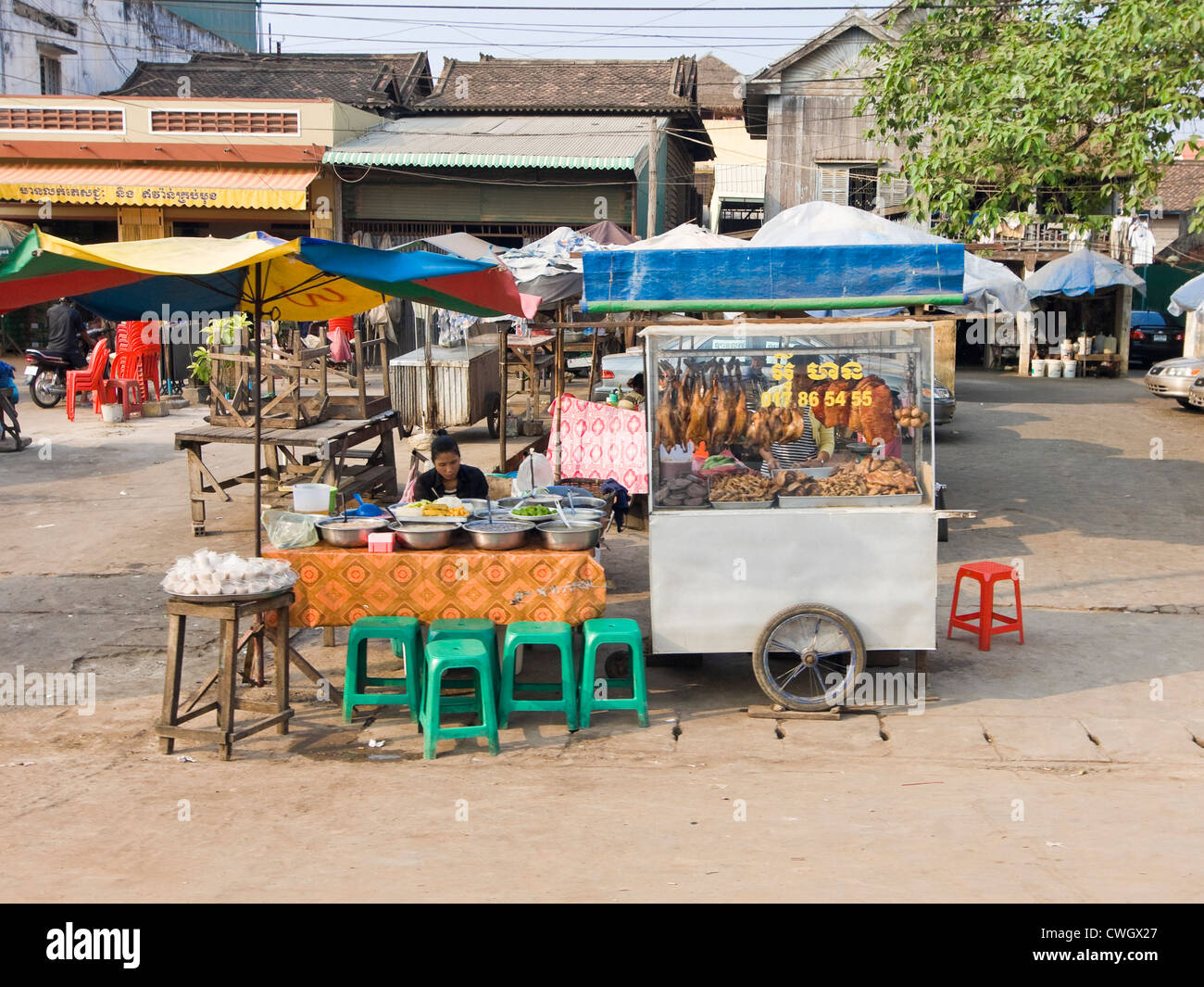 Horizontal view of a basic fastfood stall set up on the side of the ...