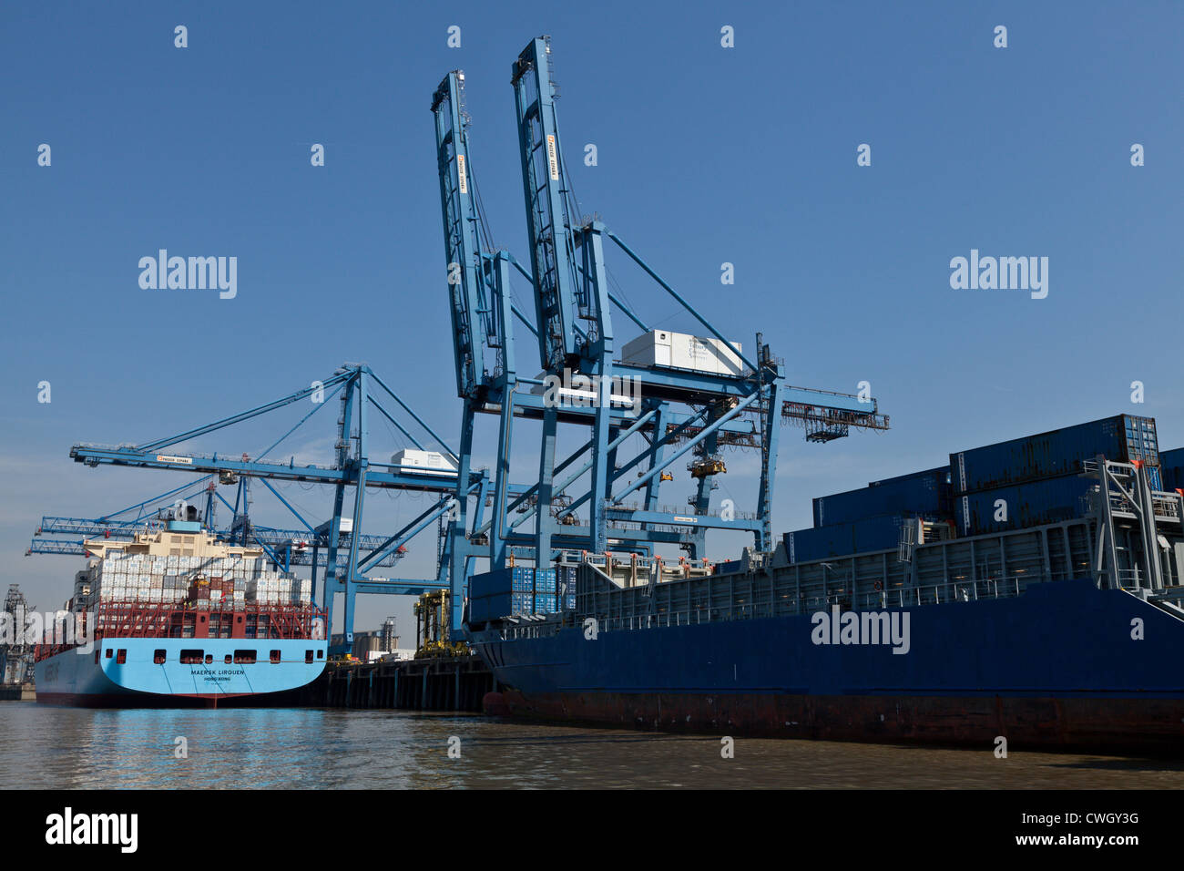 Container ship being loaded in port Stock Photo - Alamy