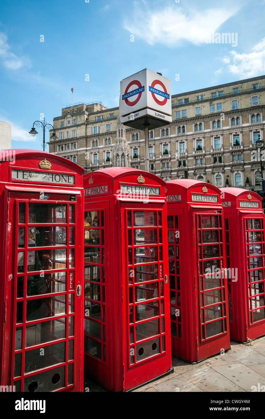 Red telephone boxes and London Underground sign Stock Photo - Alamy