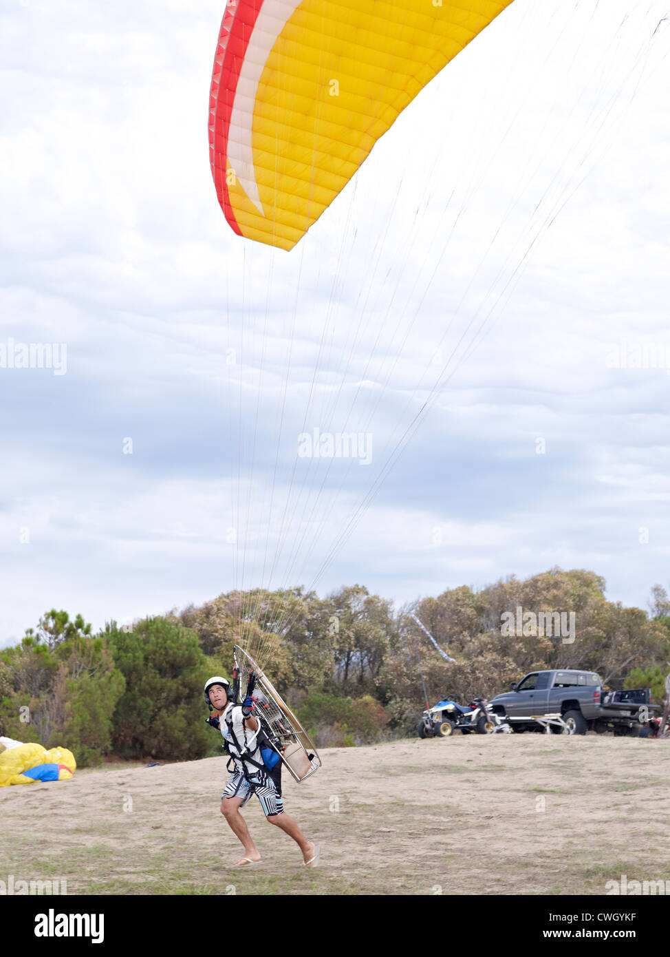 Hispanic man paragliding Stock Photo - Alamy