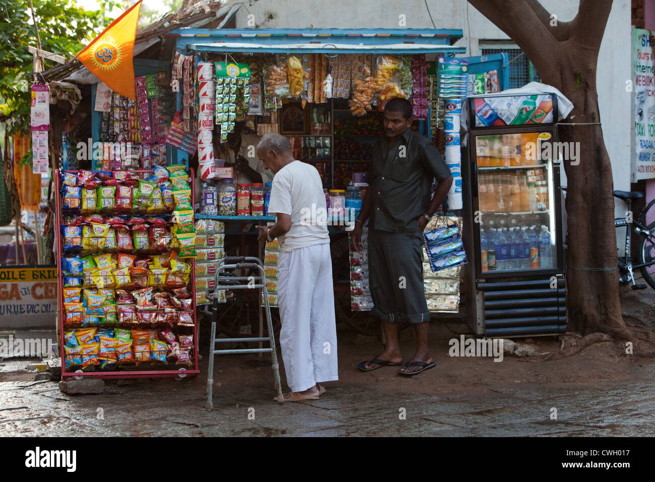 Indian people outside shop in Hampi bazaar Stock Photo - Alamy