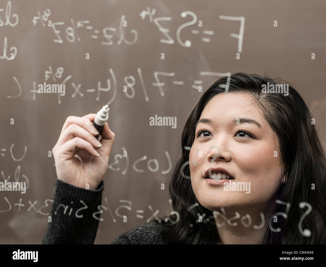 Student solving formula glass wall hi-res stock photography and images ...