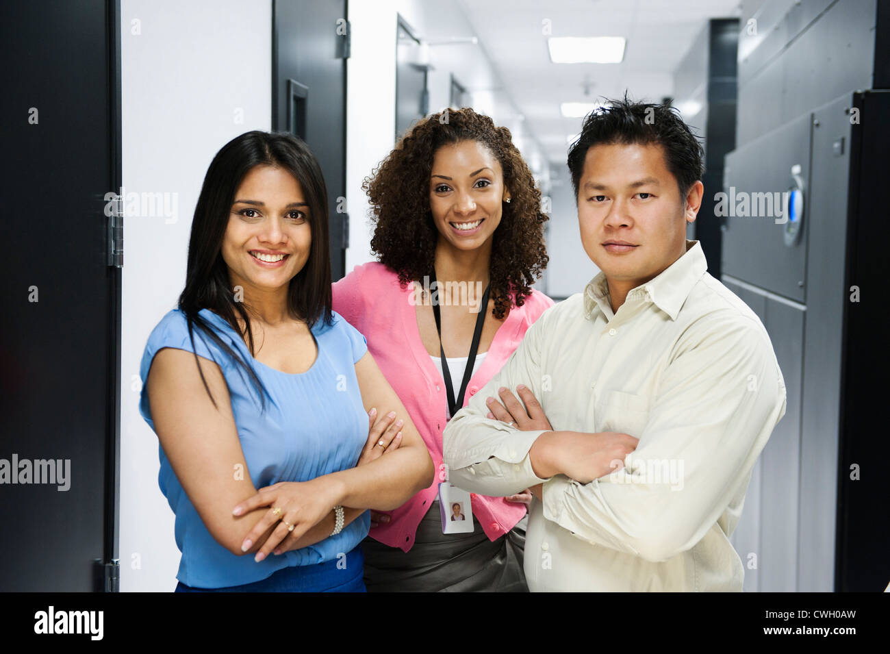 Business people standing in server room Stock Photo - Alamy