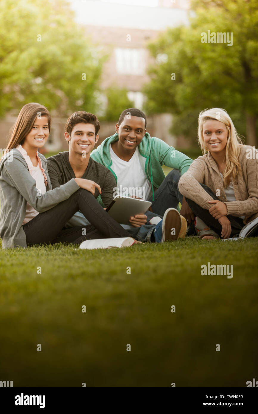 Group four smiling level students hi-res stock photography and images ...