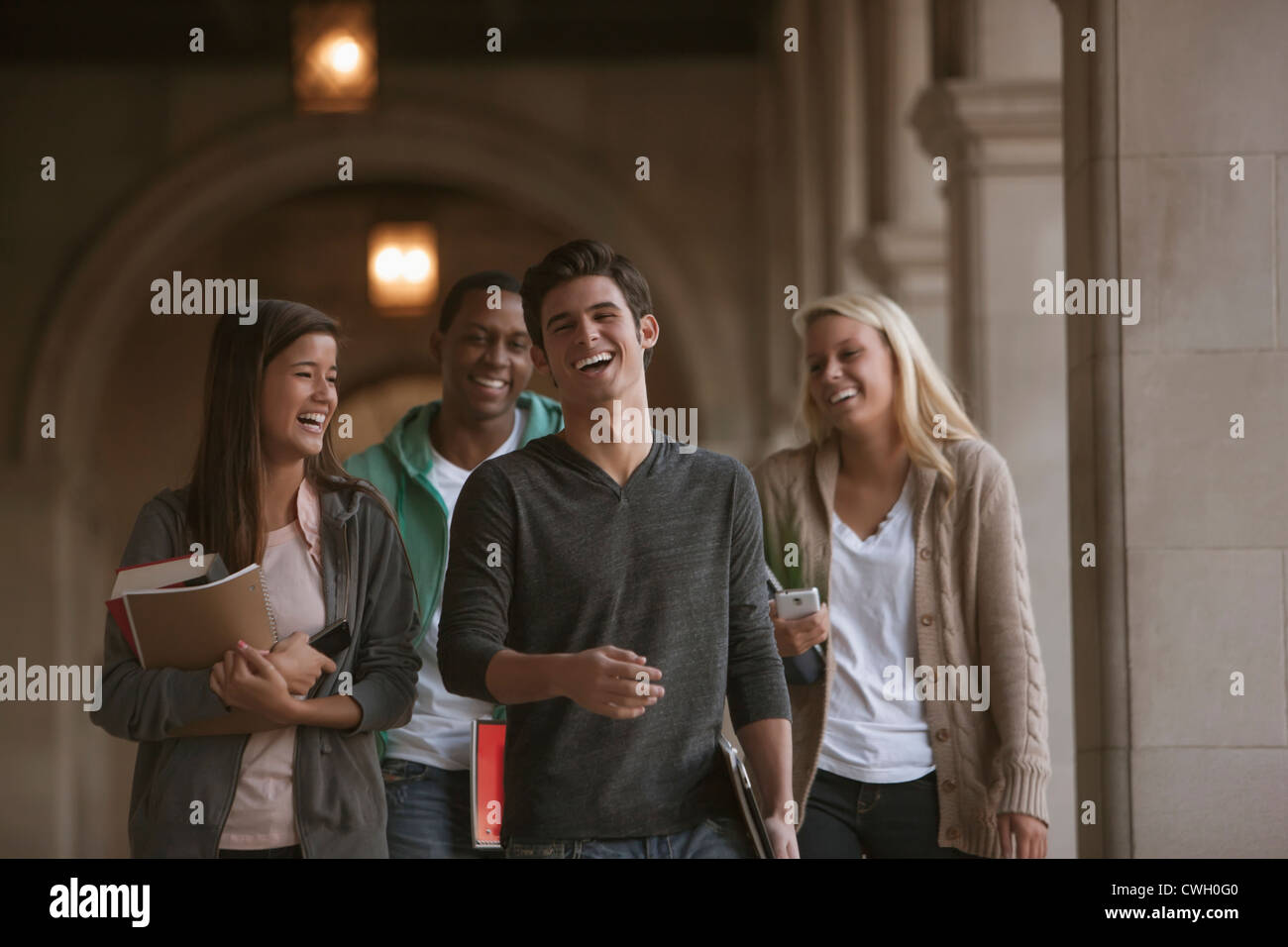 Students walking together on campus Stock Photo - Alamy
